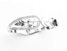 Stainless steel gift: Spring bangle with leaf design each per side ...